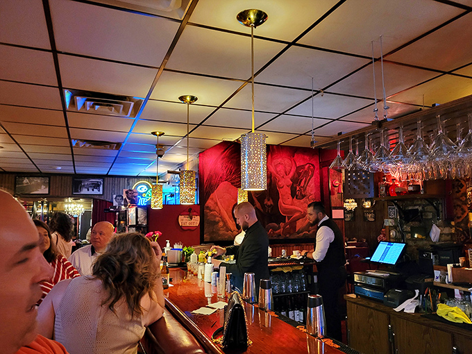 Where magic happens: bartenders orchestrating pre-dinner rituals under the warm glow of vintage lighting and Wisconsin hospitality.