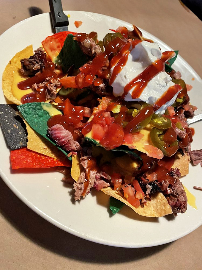 Barbecue nachos: where Tex meets Mex in a colorful fiesta of chips, smoked meat, and enough toppings to require a strategic eating plan.