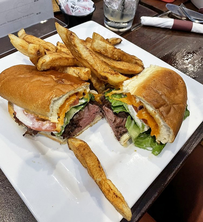 A sandwich cut in half not for sharing, but so you can admire its inner beauty. Like architectural cross-sections, but delicious.
