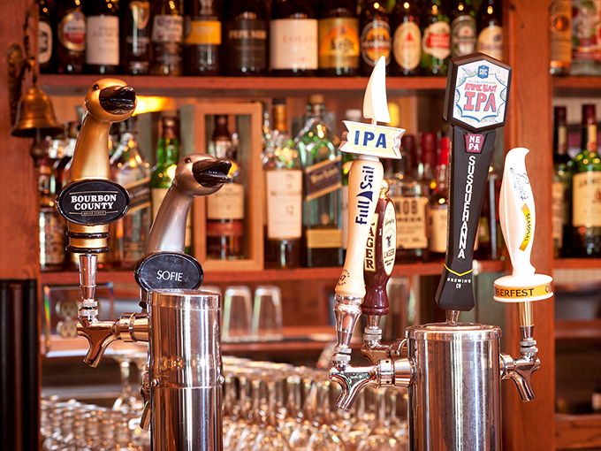 Craft beer taps standing at attention like delicious soldiers, ready to complement whatever masterpiece arrives from the kitchen.