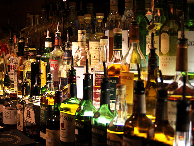 The backlit bottle display isn't just storage&mdash;it's a wall of liquid possibilities. From rare scotches to perfect bourbons, this is an adult candy store.