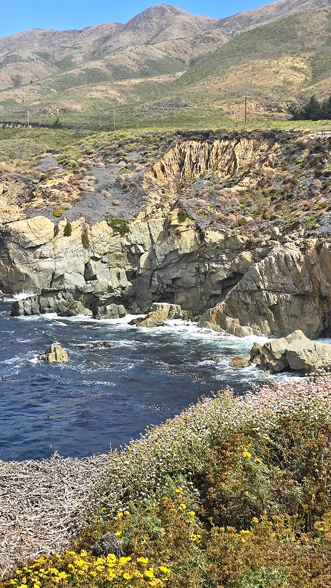 Waves perform their endless ballet against a backdrop of rugged cliffs. This view has convinced many visitors to extend their California stay indefinitely.