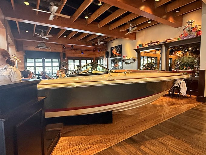 Vintage boats aren't just decoration here – they're part of the dining room, bringing nautical charm to your table experience.