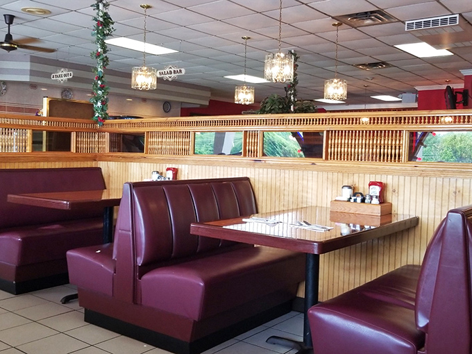 Those burgundy booths have cradled more heart-to-hearts and family celebrations than any therapist's couch. Classic diner seating never goes out of style.