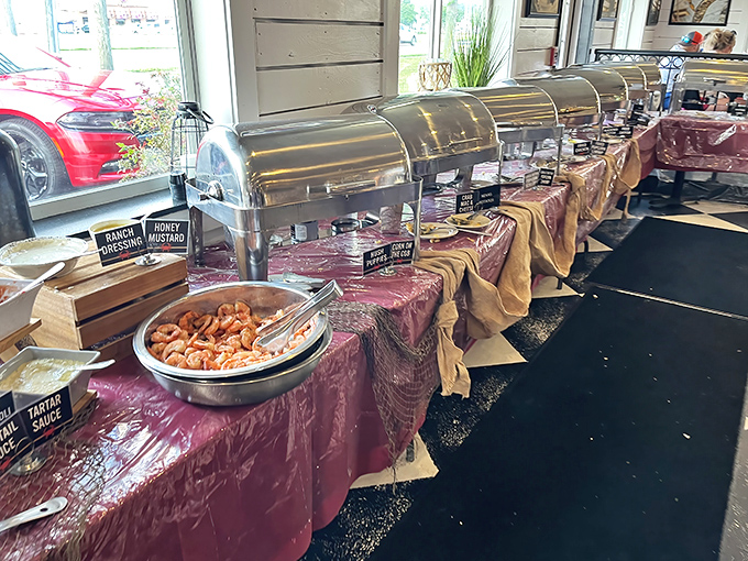 The buffet line&mdash;a seafood parade where shrimp are the stars. Those chafing dishes hold treasures that would make Neptune himself jealous.
