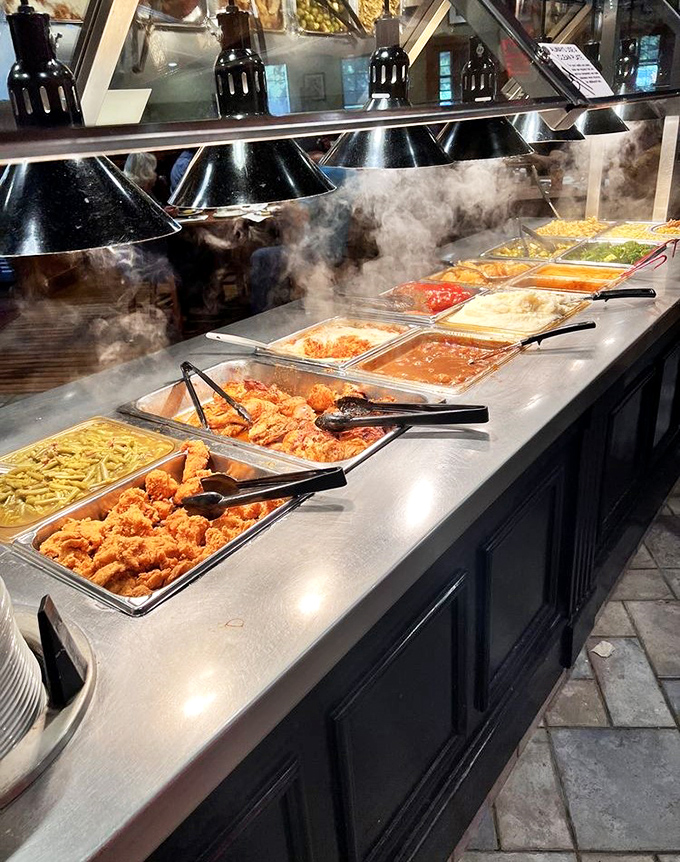 Steam rising from the buffet line like a culinary fog, revealing treasures of comfort food that make diets temporarily disappear.