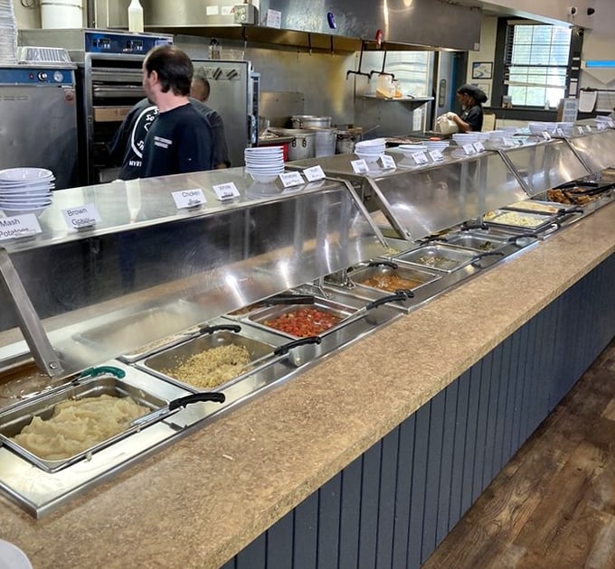 The buffet line gleams like a treasure chest, except instead of gold doubloons, it's filled with pulled pork.