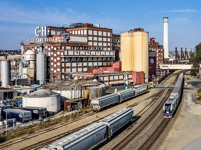 The massive C&H Sugar refinery dominates the landscape, its industrial grandeur a reminder of the sweet foundation of Crockett's economy.