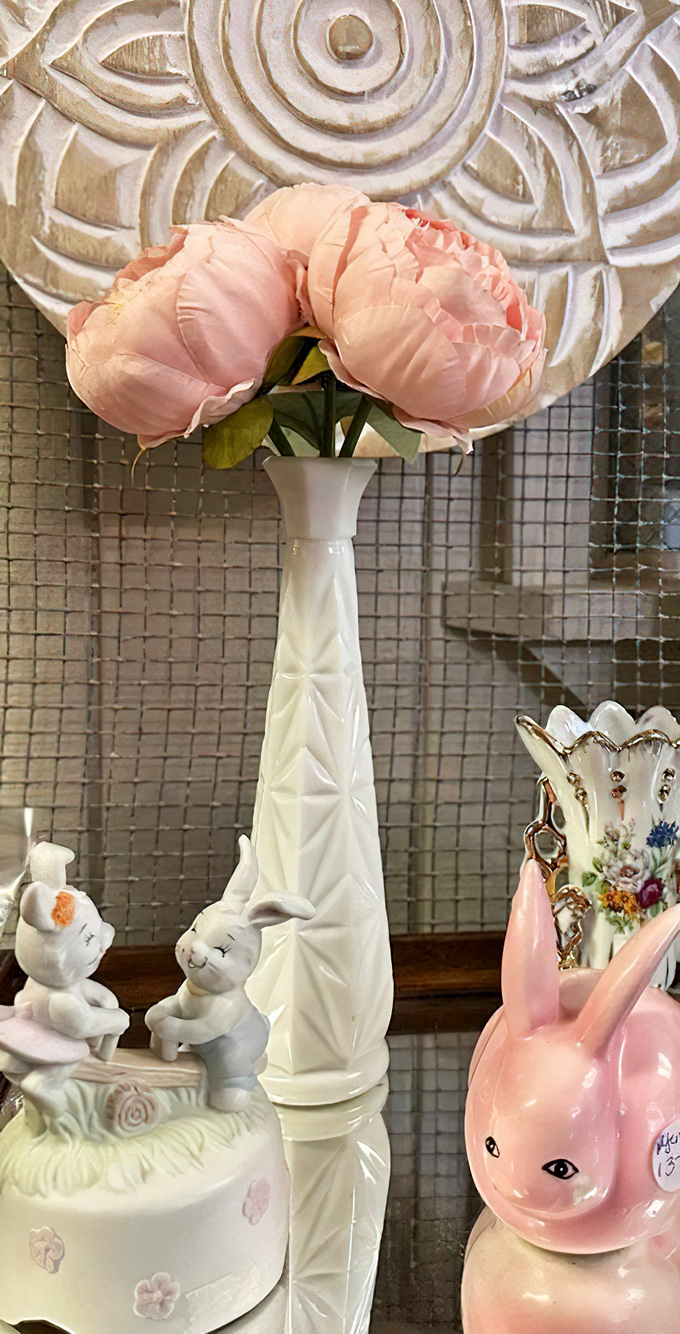 Delicate milk glass and porcelain figurines create a vignette of nostalgia that's one part grandma's house, two parts sophisticated collector's dream.