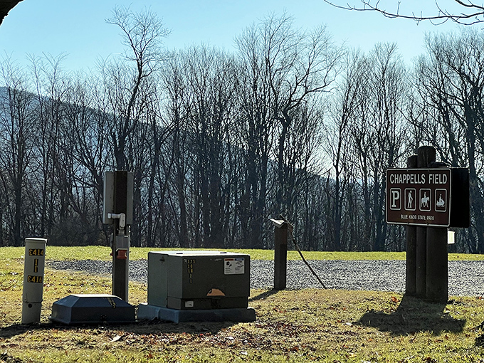 Chappells Field welcomes visitors with practical amenities and a sign promising adventures that await just beyond the clearing.