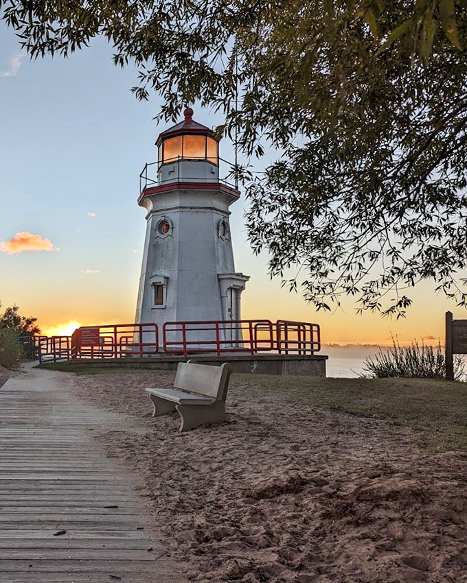 The Cheboygan lighthouse stands sentinel at sunset, a perfect backdrop for contemplating life's big questions or simply enjoying nature's nightly light show.