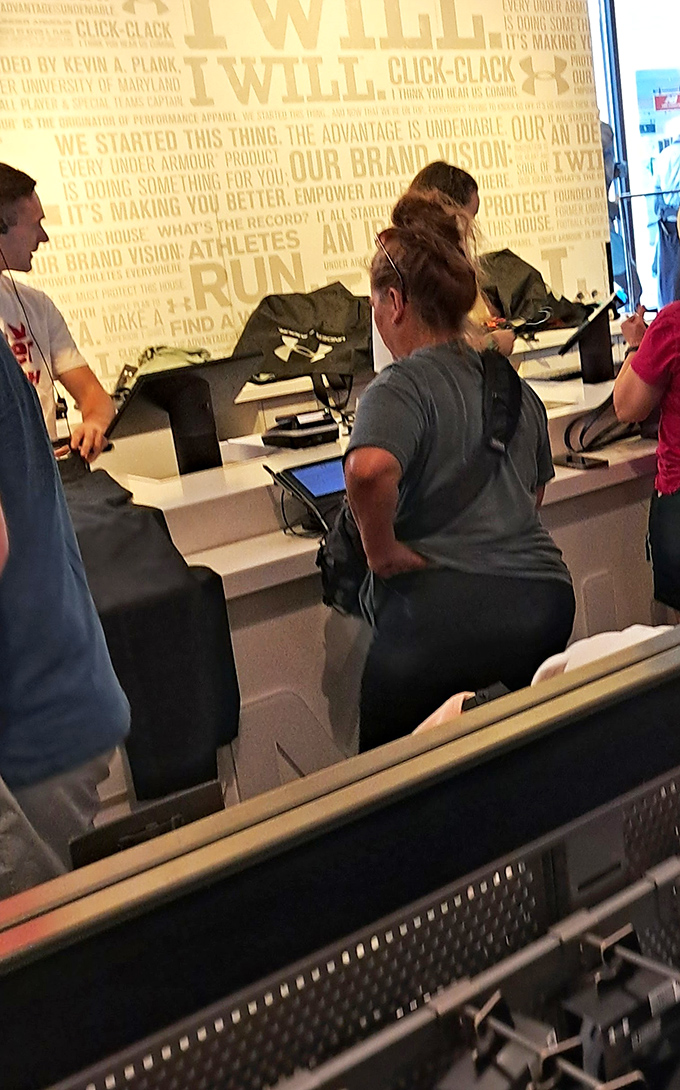 Checkout lines where victory is measured in shopping bags and savings receipts.