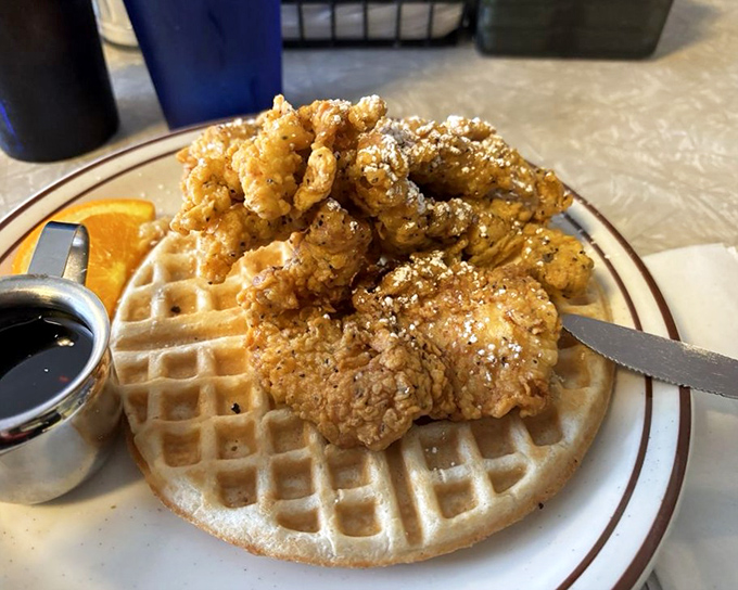 Chicken and waffles—the breakfast equivalent of a mullet: business on the bottom, party on top. That dusting of powdered sugar seals the deal.