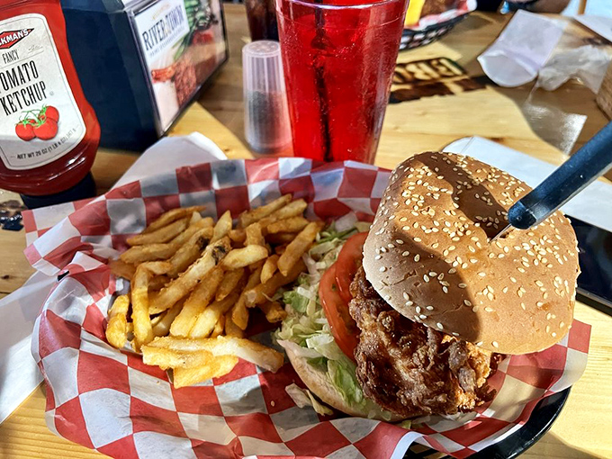 This chicken sandwich with crispy fries represents comfort food executed at its absolute finest.
