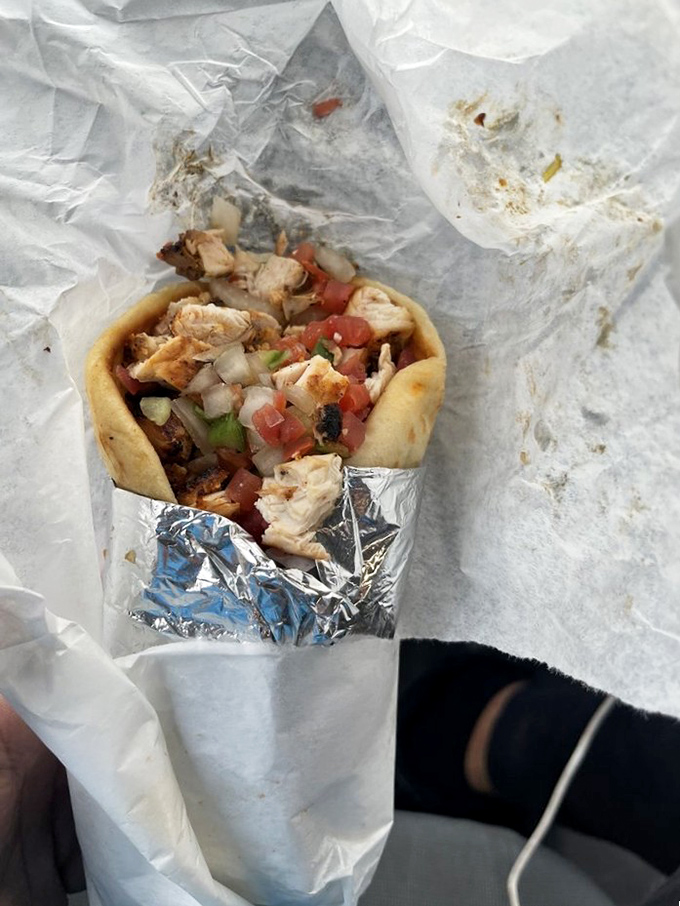 This wrap isn't just food&mdash;it's a portable feast. Fresh ingredients peeking out like they're trying to introduce themselves before being devoured.
