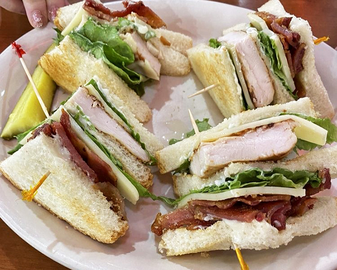 Club sandwiches: the architectural marvels of the sandwich world. This one's held together with toothpicks and hope.