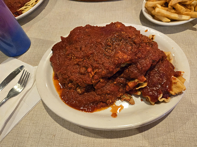 Chicken parmesan that doesn't know the meaning of restraint &ndash; a mountain of sauce and meat that requires both commitment and napkins.