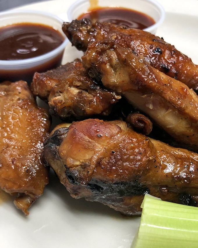 Wings that have clearly been introduced to smoke and sauce in equal measure&mdash;glistening with promise and begging to be devoured.