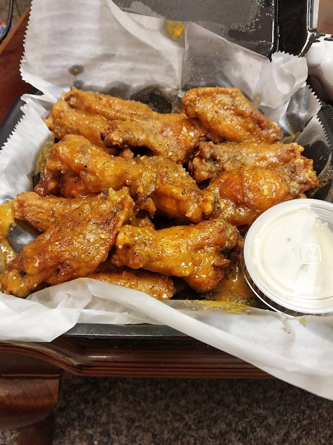 Wings so perfectly sauced they should come with a warning label. That little cup of ranch is about to embark on an important diplomatic mission.