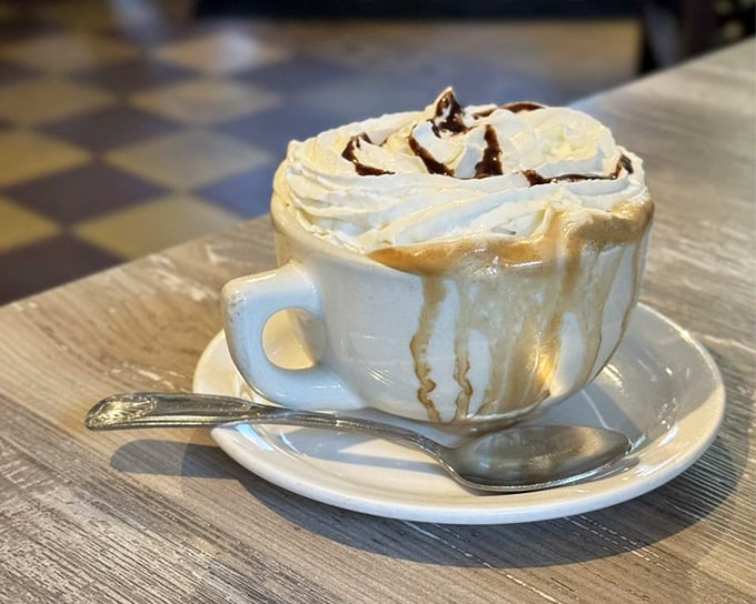 This isn't just coffee&mdash;it's a cloud of whipped cream floating atop liquid motivation, with chocolate drizzle playing the role of artistic muse.