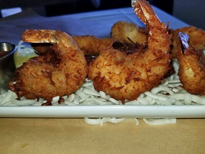 Coconut shrimp that look like they're resting on a beach of rice. Tropical vacation vibes without the airfare.