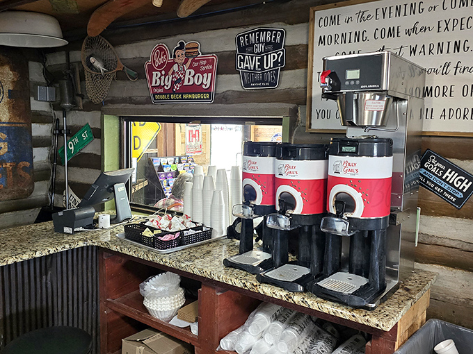 Coffee station ready for the morning rush. That inspirational wall quote basically translates to "Come hungry, leave happy, return often."