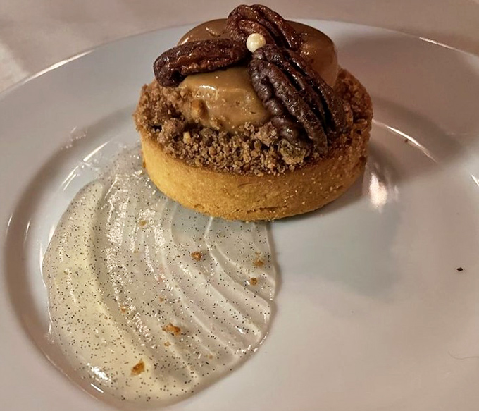This dessert isn't just served; it's presented&mdash;a pecan tart that's dressed better than most people at a wedding.