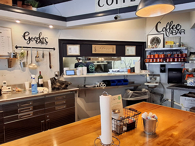 "Goodies" indeed! The coffee bar promises liquid motivation while the open kitchen layout lets you witness breakfast alchemy in action.