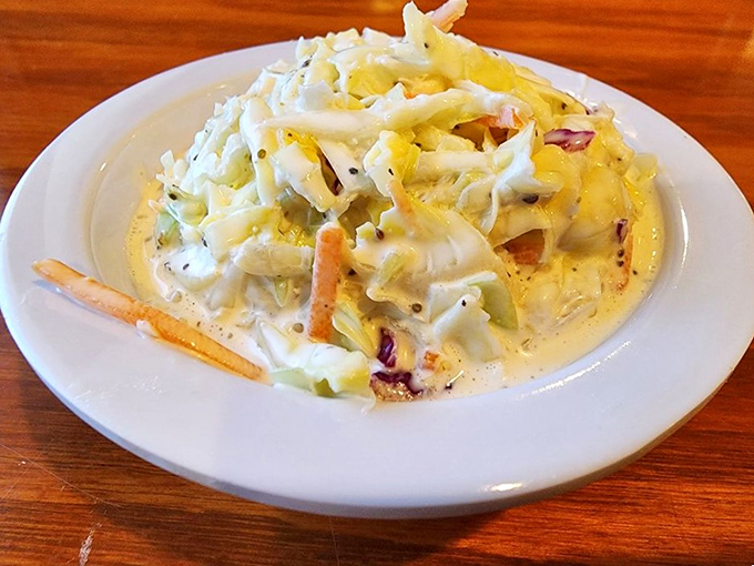 Coleslaw reimagined as something worthy of the seafood it accompanies. Not an afterthought, but a proper supporting actor.