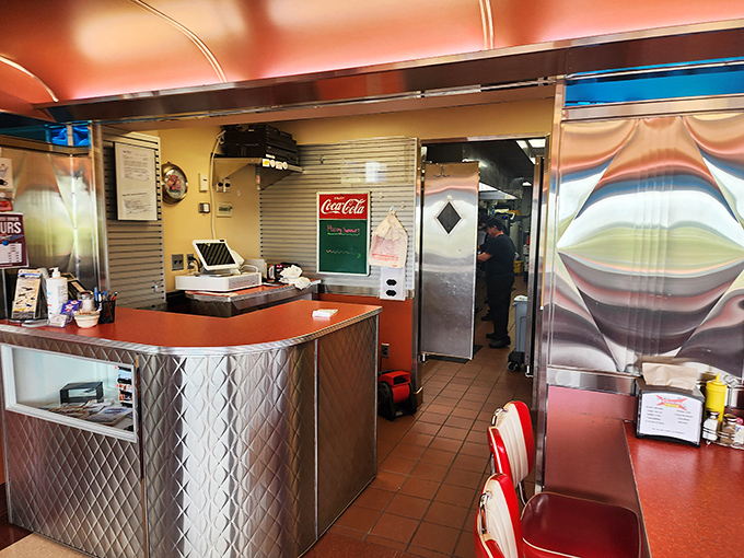 Stainless steel meets retro charm at this aviation-themed counter. Even the coffee mugs look ready to take flight.
