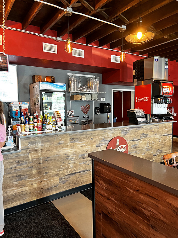 The rustic wooden counter and industrial lighting create the perfect stage for burger magic to happen.