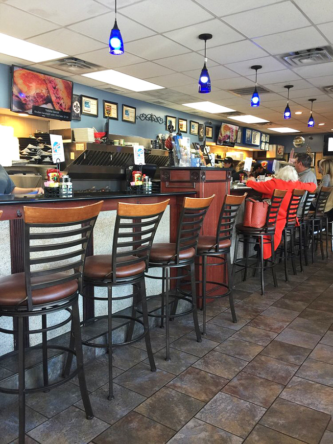 The counter's high-backed chairs stand like sentinels, guarding the sacred space where coffee refills and friendly banter are always on the menu.