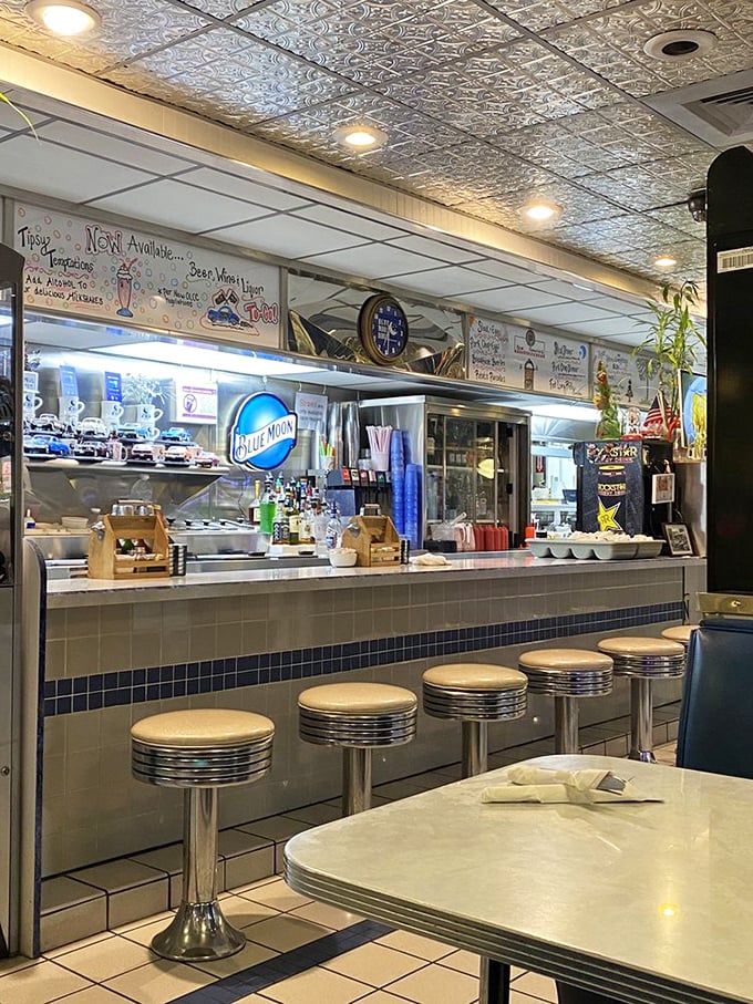 The counter where breakfast dreams come true. Those swivel stools have supported generations of hungry diners waiting for their morning fix.