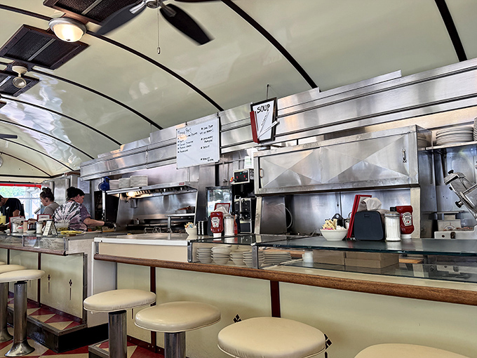 The diner's beating heart: a counter where solo diners never feel alone, where coffee cups are never empty, and where the sizzle of the grill provides the soundtrack.