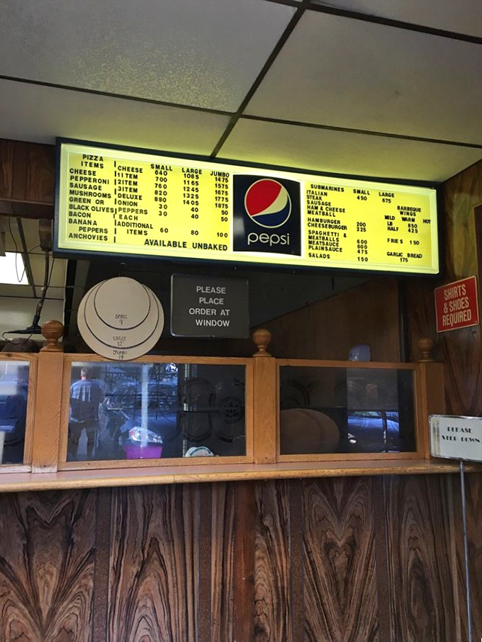The ordering counter&mdash;where dreams become reality and diet plans go to die. That illuminated menu board is basically a roadmap to happiness. 
