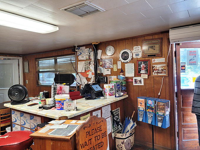 The counter area serves as command central, where orders are shouted, tickets are hung, and the organized chaos of a beloved local institution unfolds.