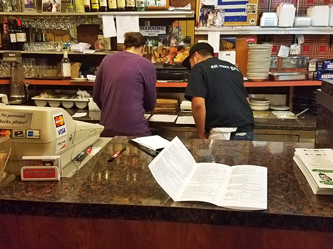 The bustling counter where orders come together like a well-choreographed dance of Mediterranean hospitality and efficiency.