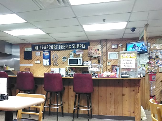 The counter where magic happens. That "Millersport Feed & Supply" sign hints at the restaurant's deep roots in this lakeside community.