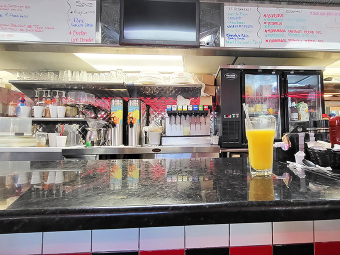 The classic diner counter where solo diners find community and great conversations happen naturally.
