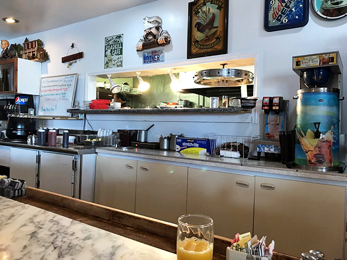 Behind the counter, where breakfast magic happens, seasoned cooks orchestrate the morning symphony of sizzles and aromas.