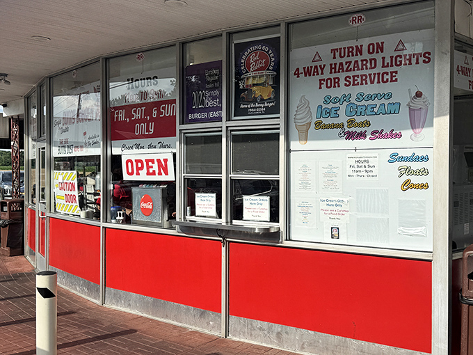 The ordering window &ndash; where dreams and hunger meet. Those red panels have witnessed generations of "I'll have the usual" conversations.