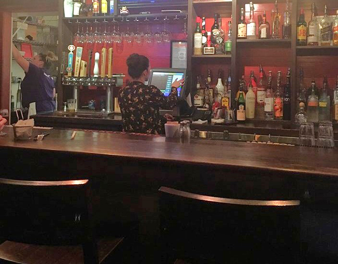 Behind the bar, where liquid happiness is crafted with the same care as the food. Cocktails that don't just accompany burgers&mdash;they celebrate them.