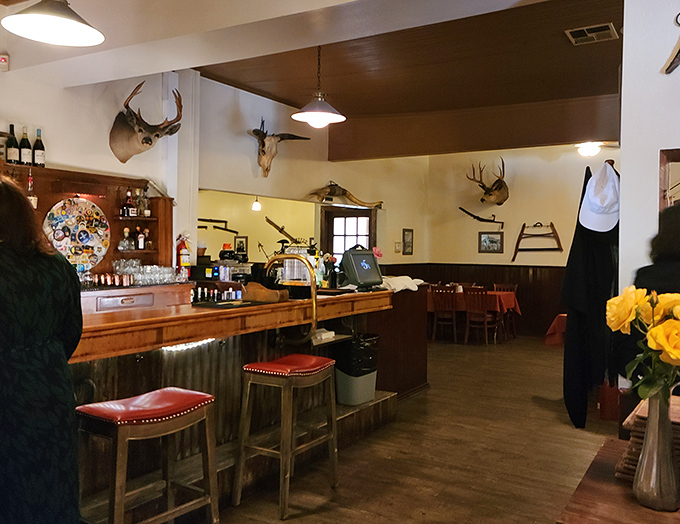 Mounted trophies watch over diners from wood-paneled walls, silent witnesses to decades of celebratory meals and special occasions.