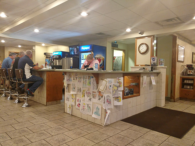 The counter seats—where regulars perch like birds on a wire, watching sports and sharing the day's stories over coffee.