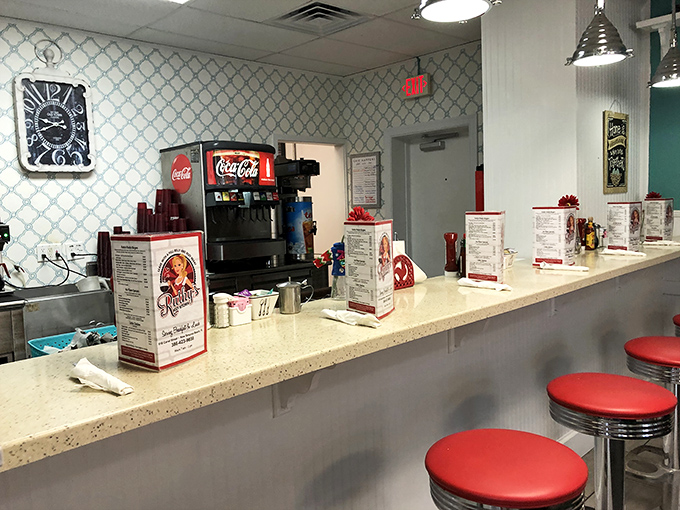 Counter seating offers front-row tickets to the breakfast show, where every order becomes culinary theater magic.