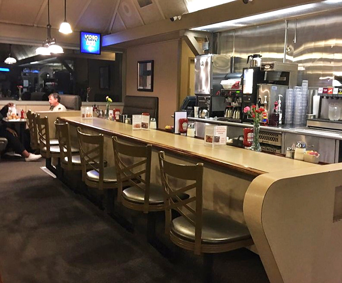 The counter seating offers front-row views of culinary choreography, where regulars exchange friendly banter with longtime staff.