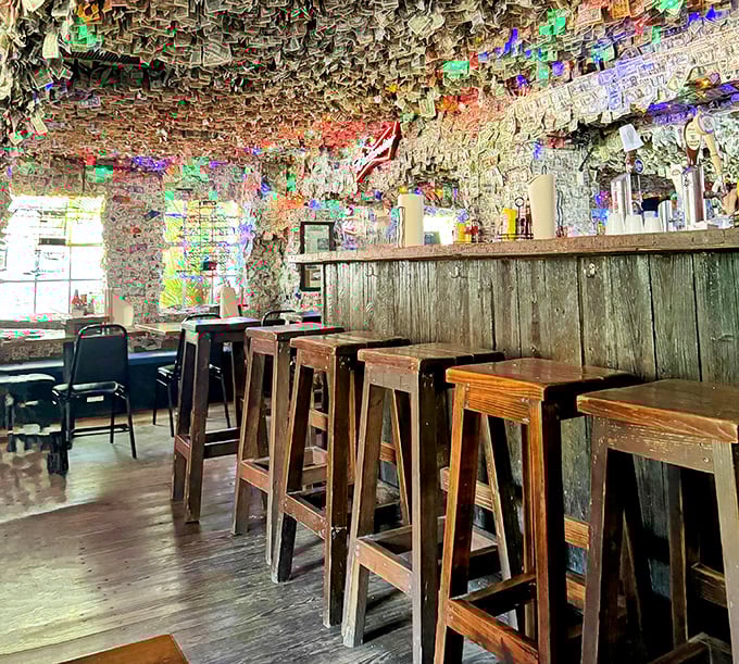 Bar seating that invites conversation with both your companions and the weathered wooden stools that have supported decades of happy diners.