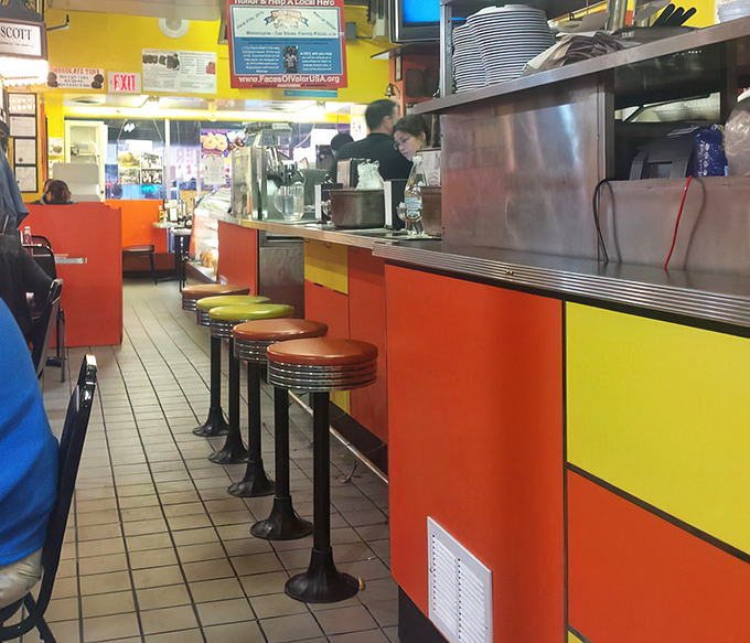 Classic diner counter seating: where solo diners become part of the Chick & Ruth's family and breakfast becomes theater.