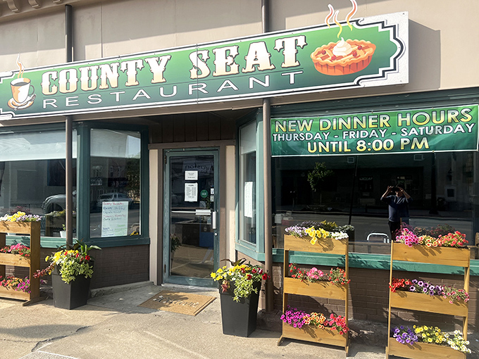 County Seat Restaurant's flower-framed entrance offers a preview of the homestyle warmth waiting inside, where every meal feels like Sunday dinner at grandma's.