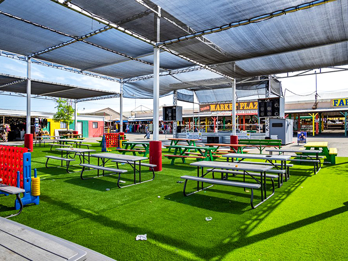 The oasis amid the marketplace madness. These shaded picnic tables offer respite for weary shoppers and a place to sample culinary discoveries. 